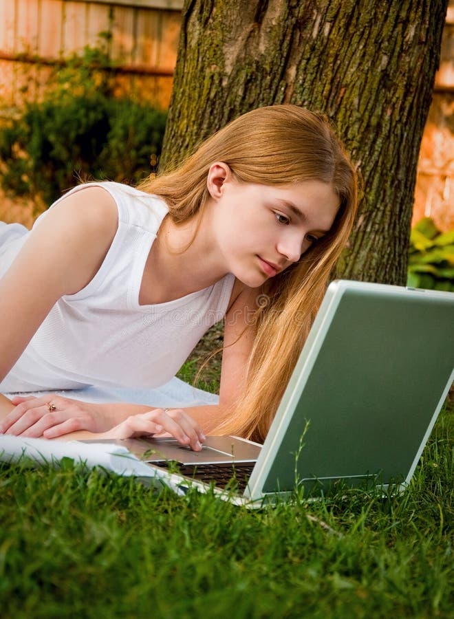 Girl on Laptop in Yard stock image. Image of keyboard - 16803391