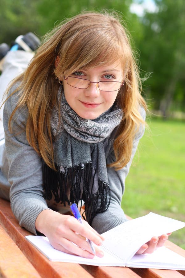 The Girl Lay on a Bench, and Write Stock Photo - Image of school, body ...