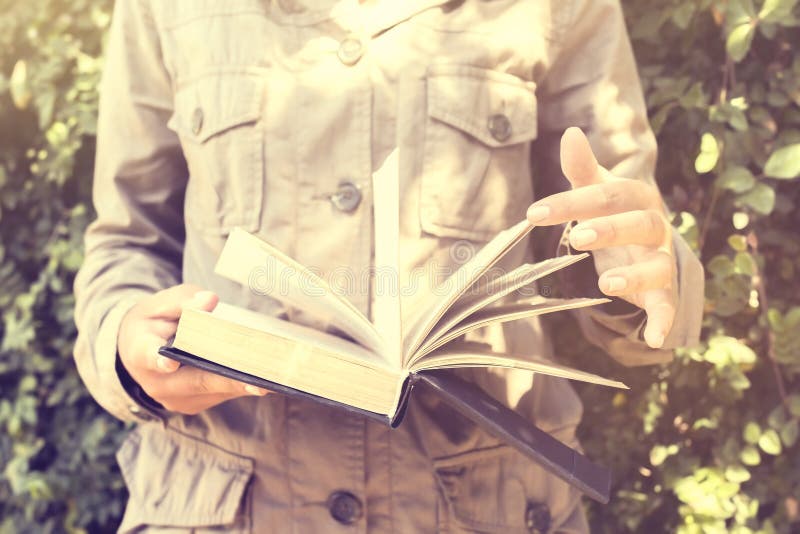 Girl leafing through pages stock image. Image of people - 60370451