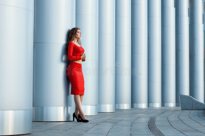 Girl Leaned Against the Column. she is Trendy Red Suit. Stock Image ...