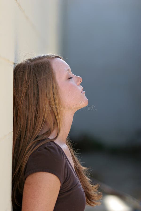 Girl leaning against wall stock photo. Image of slim, young - 724038