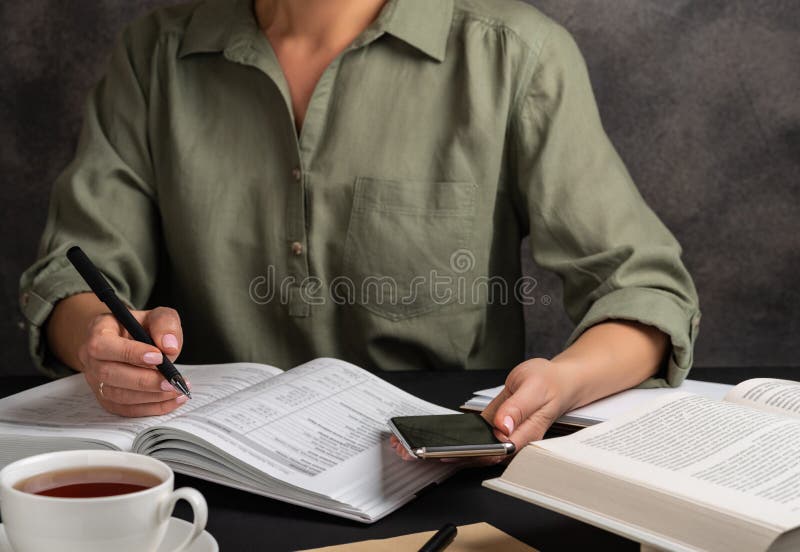 Girl Learning and Holding Smartphone in Her Hand. Self Education ...