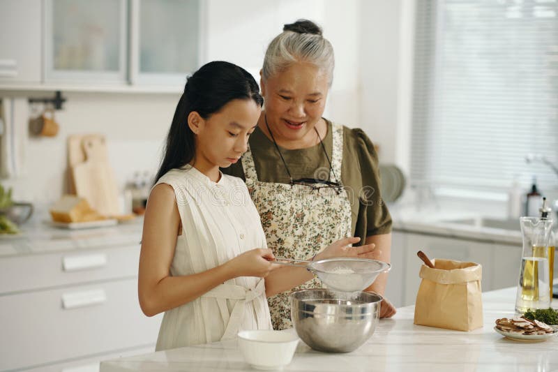 Girl Learning To Bake Cake with Grandma Stock Image - Image of ...