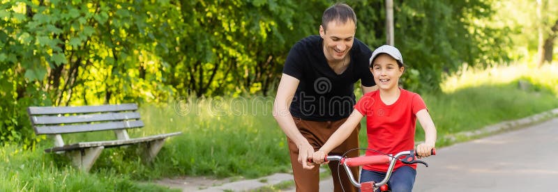 Girl learning to ride bike stock image. Image of father - 255127985
