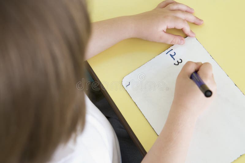 Boy Learning To Write Numbers in Primary Class Stock Image - Image of ...