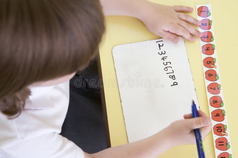Girl Learning To Write Numbers in Primary Class Stock Image - Image of ...