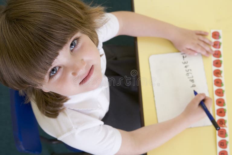 Girl Learning To Write Numbers in Primary Class Stock Image - Image of ...
