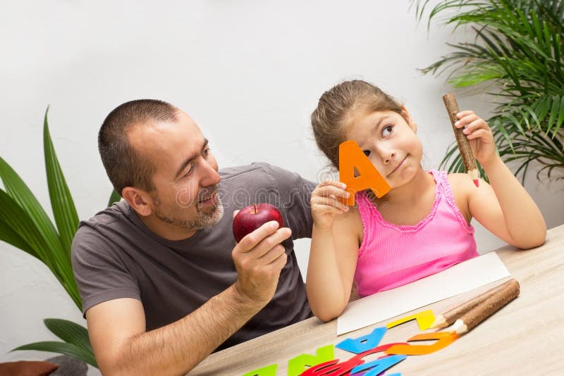 Girl learns the alphabet stock photo. Image of granddaughter - 46147276
