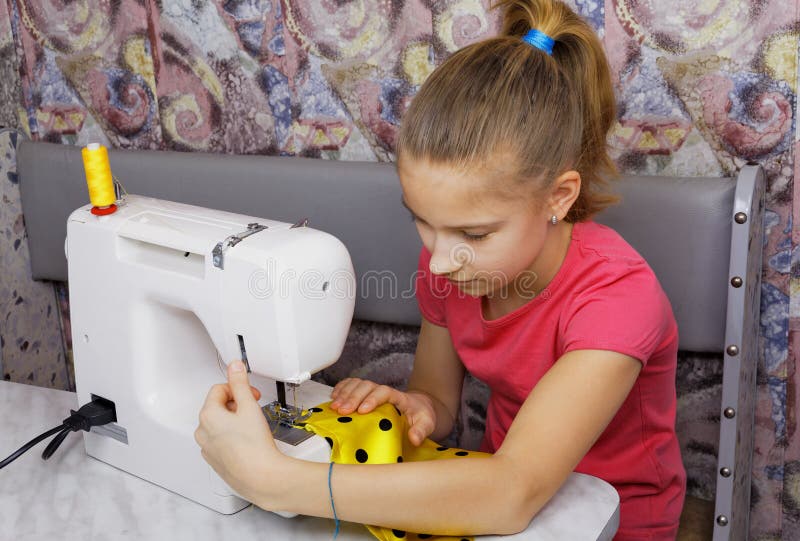 Girl Learns To Sew on an Electric Sewing Machine Stock Image - Image of ...