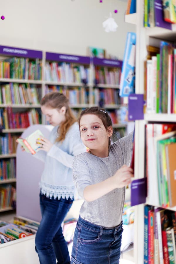 School Girl in Library Choosing Books. Stock Image - Image of knowledge ...