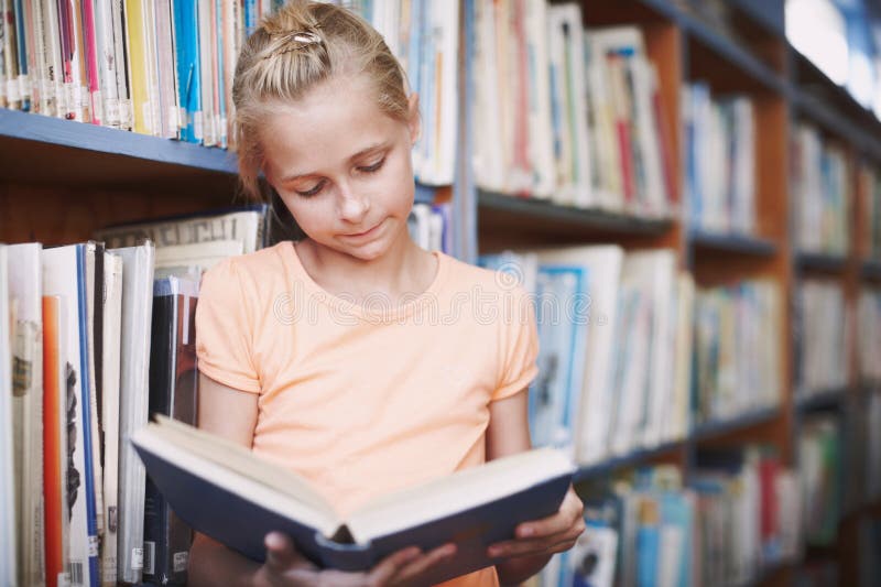 Girl, Library and Serious for Reading Book at Elementary School for ...
