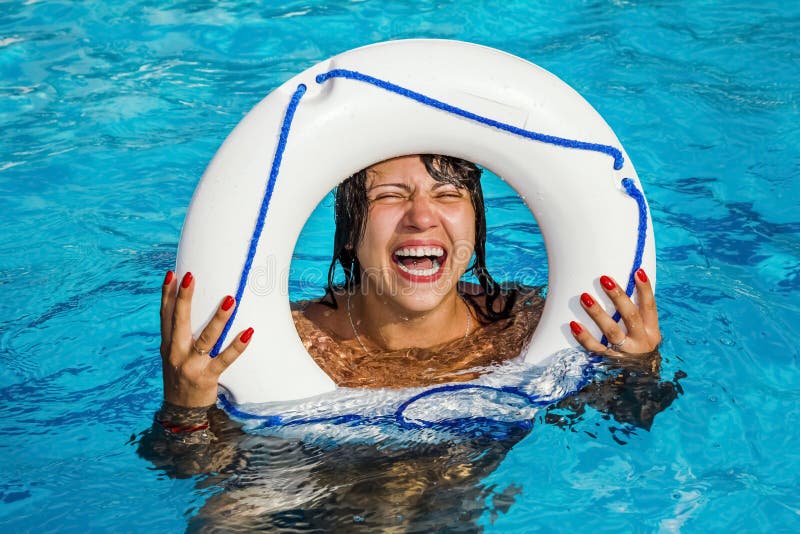 The Girl with the Lifeline Has Fun in the Pool Stock Photo - Image of ...