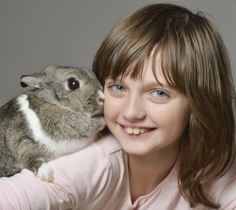 Girl with little rabbit stock image. Image of little - 80430807