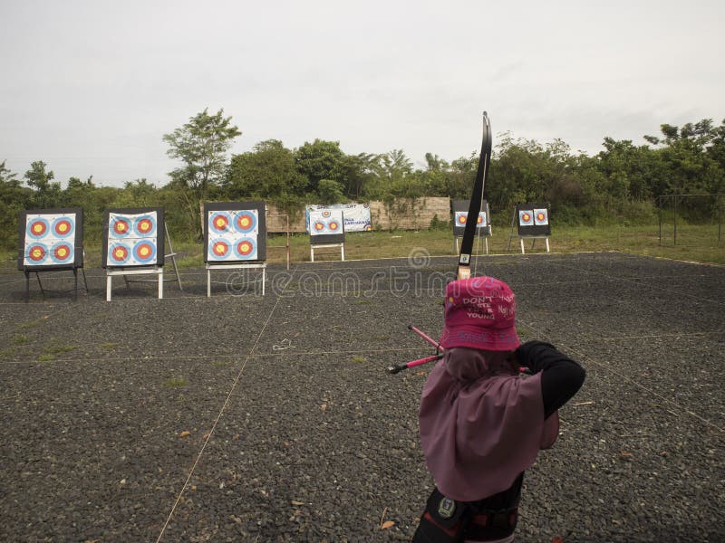 A Girl is Located in Archery. Use a Pink Hat and Raise a Bow Stock ...