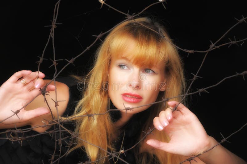 Girl Looking through Barbed Wire Stock Image - Image of attractive ...