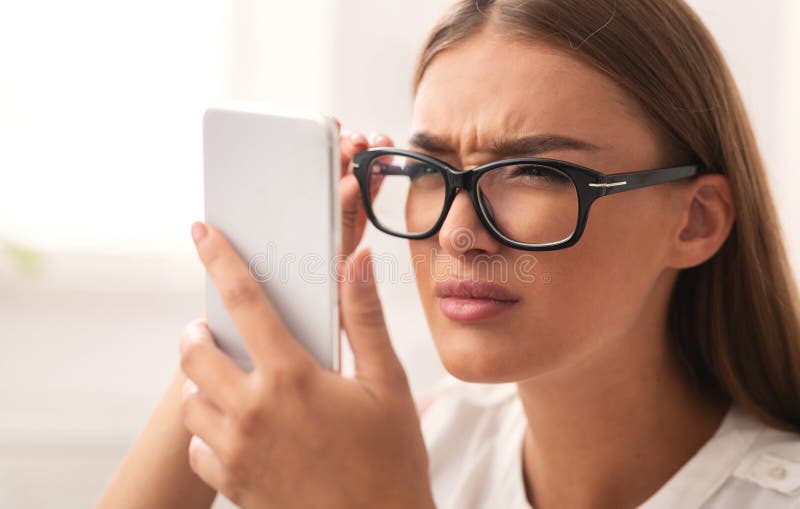 Girl Looking at Cellphone through Eyeglasses Having Vision Problem ...