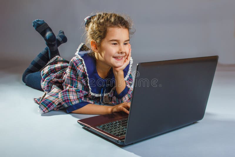 Girl Looking at a Computer Monitor and Smiling Stock Photo - Image of ...