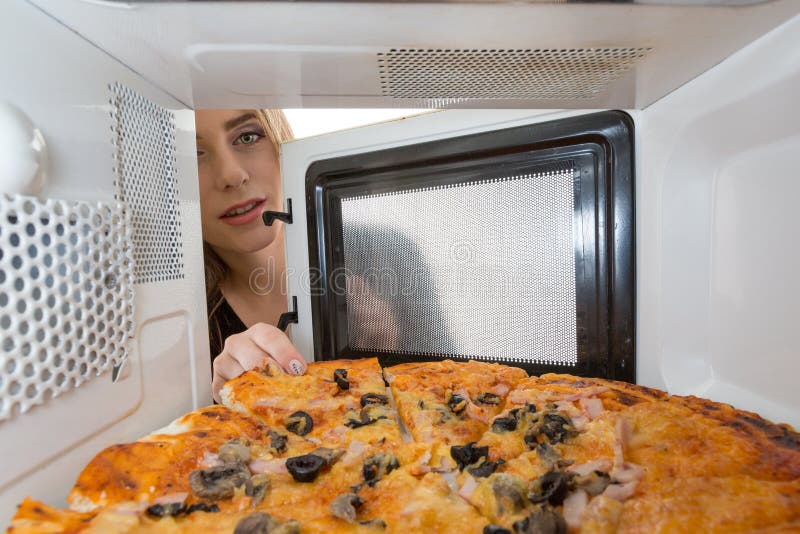 The Girl Looking in a Microwave Stock Photo - Image of looks, feminine ...