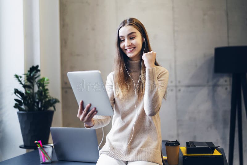 Girl Looking Optimistic with Tablet in Hands. Creative Manager Working ...