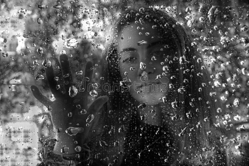 Girl Looking Out the Window while it`s Raining Stock Photo - Image of ...