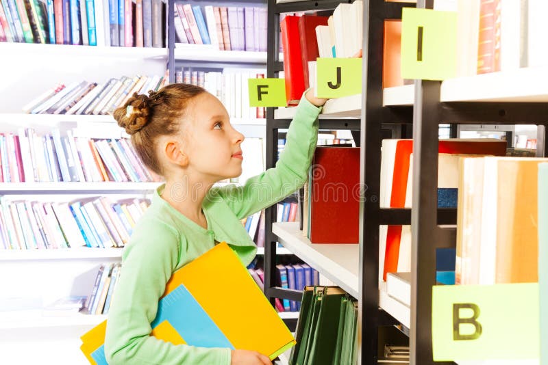 Girl Looking and Searching Books in Library Stock Photo - Image of ...