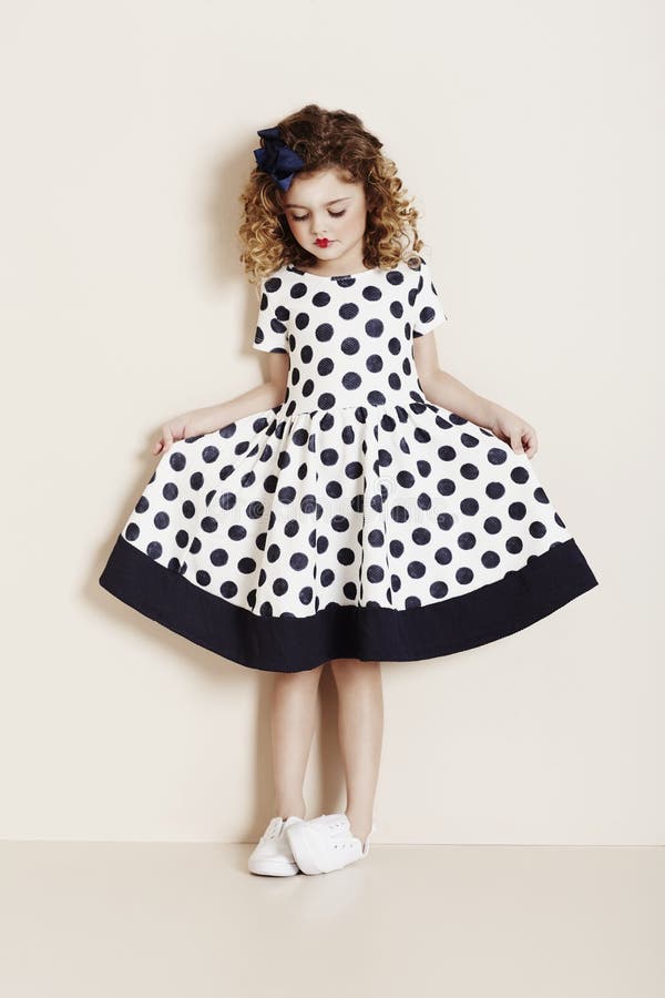 Girl in Spotty Dress on Tricycle Stock Photo - Image of girls, polka ...