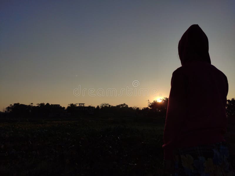 Girl looking at sun rise stock photo. Image of girl - 168070746