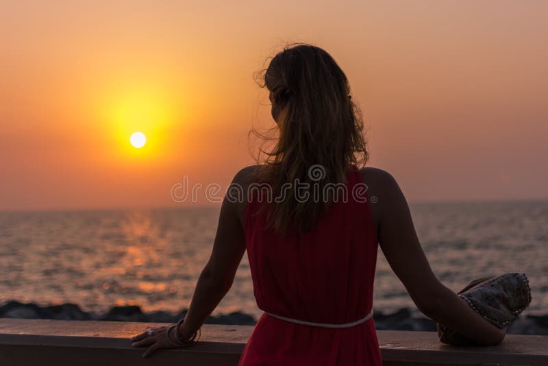 Girl looking at sunset stock image. Image of water, woman - 38816657