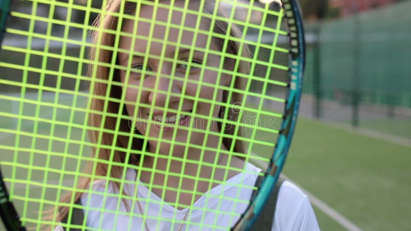 Girl Looking through the Tennis Racket Stock Video - Video of pretty ...