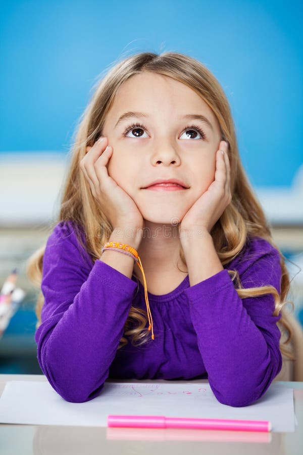 Girl Looking Up while Sitting with Head in Hands Stock Image - Image of ...