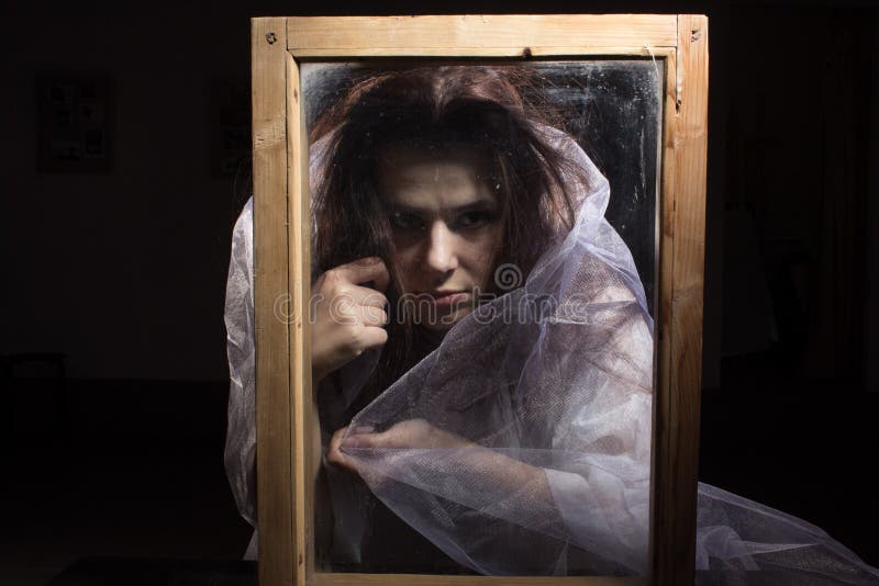 Girl Looking at the Viewer through the Frame. the Concept of ...