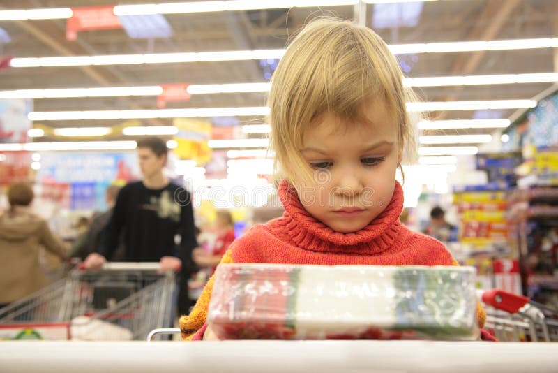 Girl looks at box in store stock image. Image of indoors - 4206991