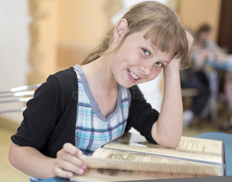 The girl looks the menu stock image. Image of menu, smiles - 25407265