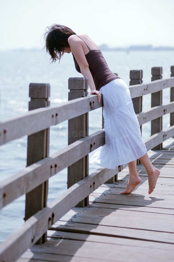 Girl Looks Over Railing Picture. Image: 10015757