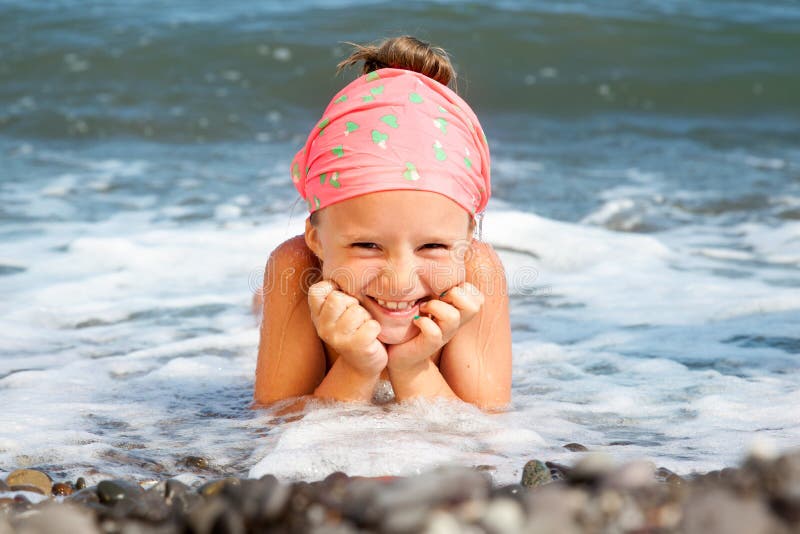 Girl lying on the beach stock image. Image of holidays - 66009077