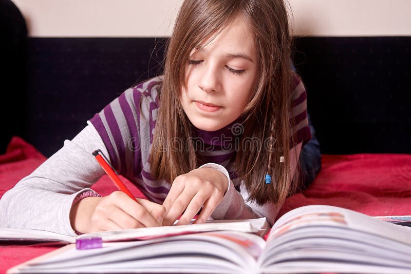 Girl doing homework stock image. Image of cute, girl - 99579093