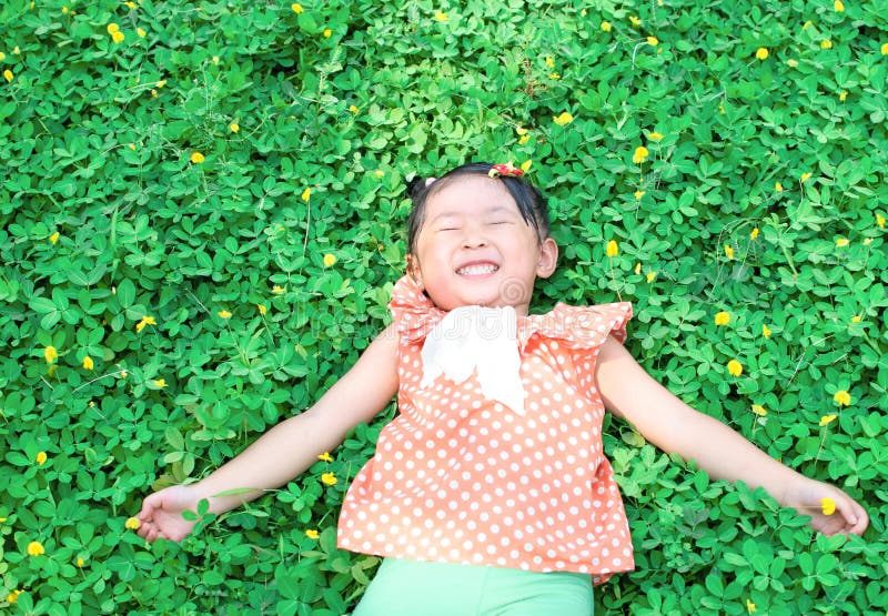 Girl lying on the lawn stock photo. Image of happiness - 36528386