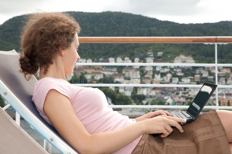 Girl Lying on Sunbed with Laptop on Deck Stock Photo - Image of ship ...