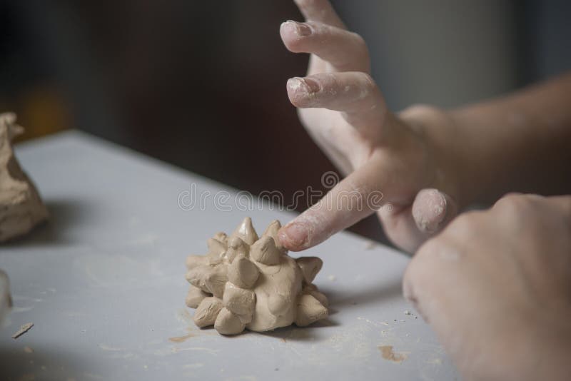 Girl make toy from clay stock image. Image of molding - 34877843