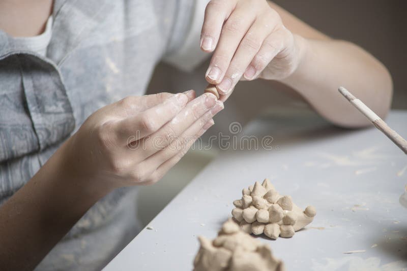 Girl make toy from clay stock image. Image of human, creativity - 34877905