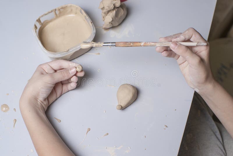 Girl make toy from clay stock photo. Image of craftsperson - 34877980