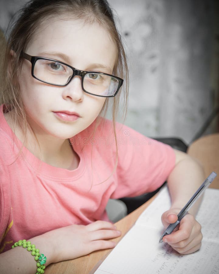 Girl make written lessons. stock photo. Image of knowledge - 55291702