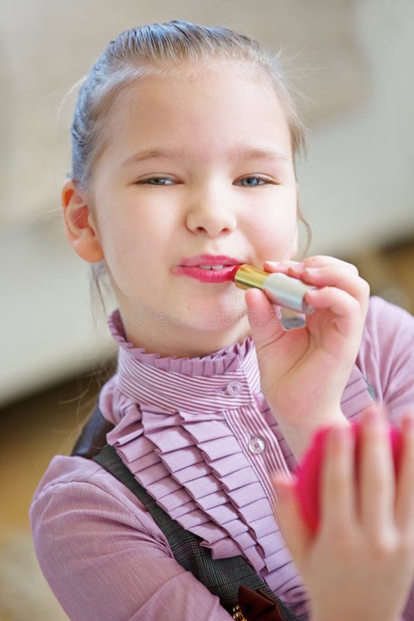 Girl Makes Up Her Lips with Lipstick Stock Photo - Image of mouth, girl ...