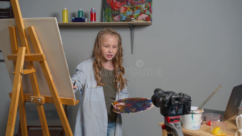Girl Makes a Video As she Paints a Picture Stock Image - Image of color ...