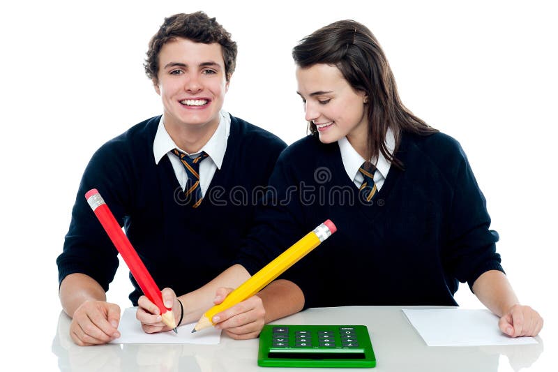 Girl Making Corrections on Her Partners Paper Stock Photo - Image of ...