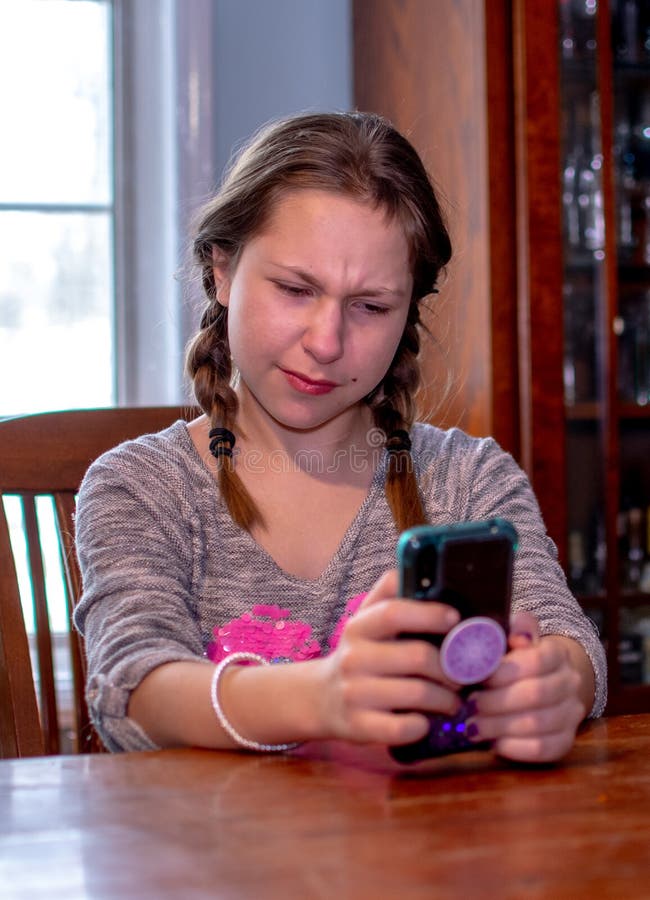 Girl Making Face Over Message on Her Phone Stock Image - Image of call ...