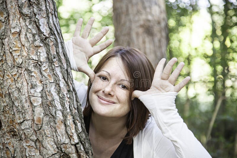 Girl mocking tree stock image. Image of caucasian, casual - 45000165