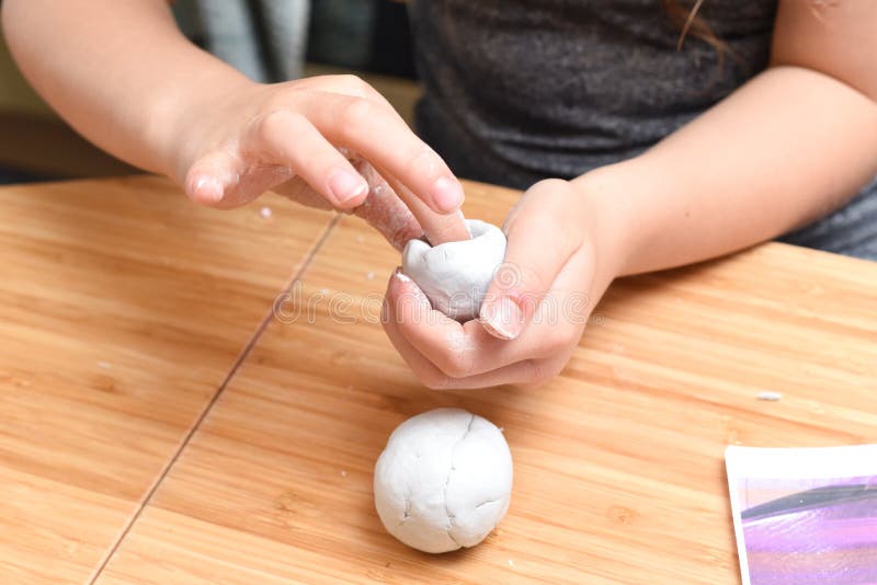 Girl Making Pottery Models with White Clay at Home Stock Image - Image ...
