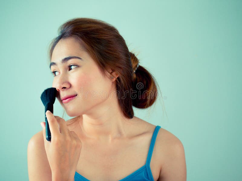 Girl making up with blush stock photo. Image of pretty - 70833428