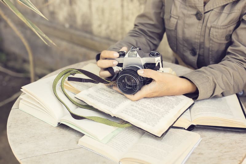Girl with Many Open Books and Old Style Camera Stock Image - Image of ...